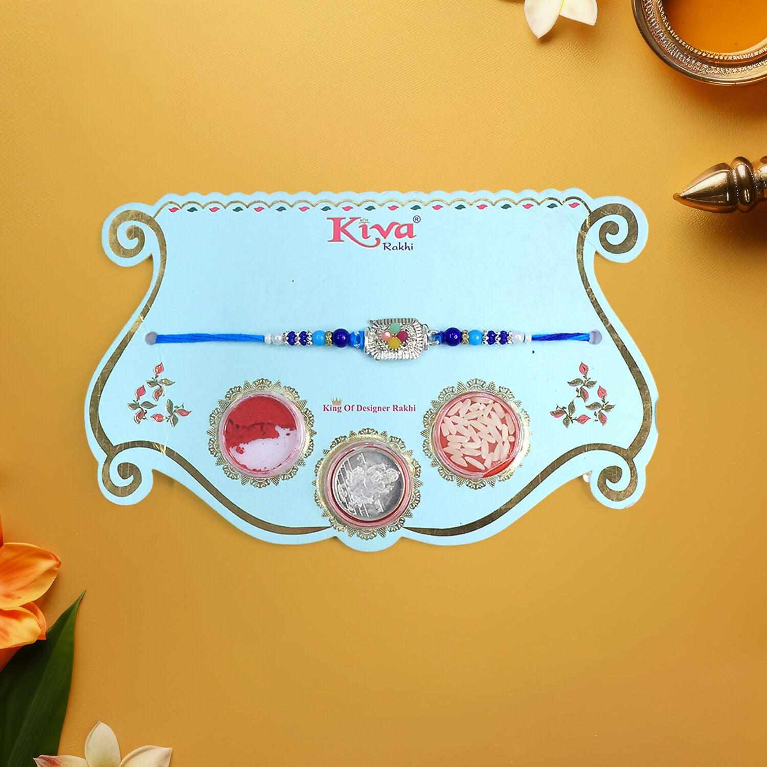 Elegant Silver Rectangular Rakhi with Blue Beads – Roli Chawal Pack In