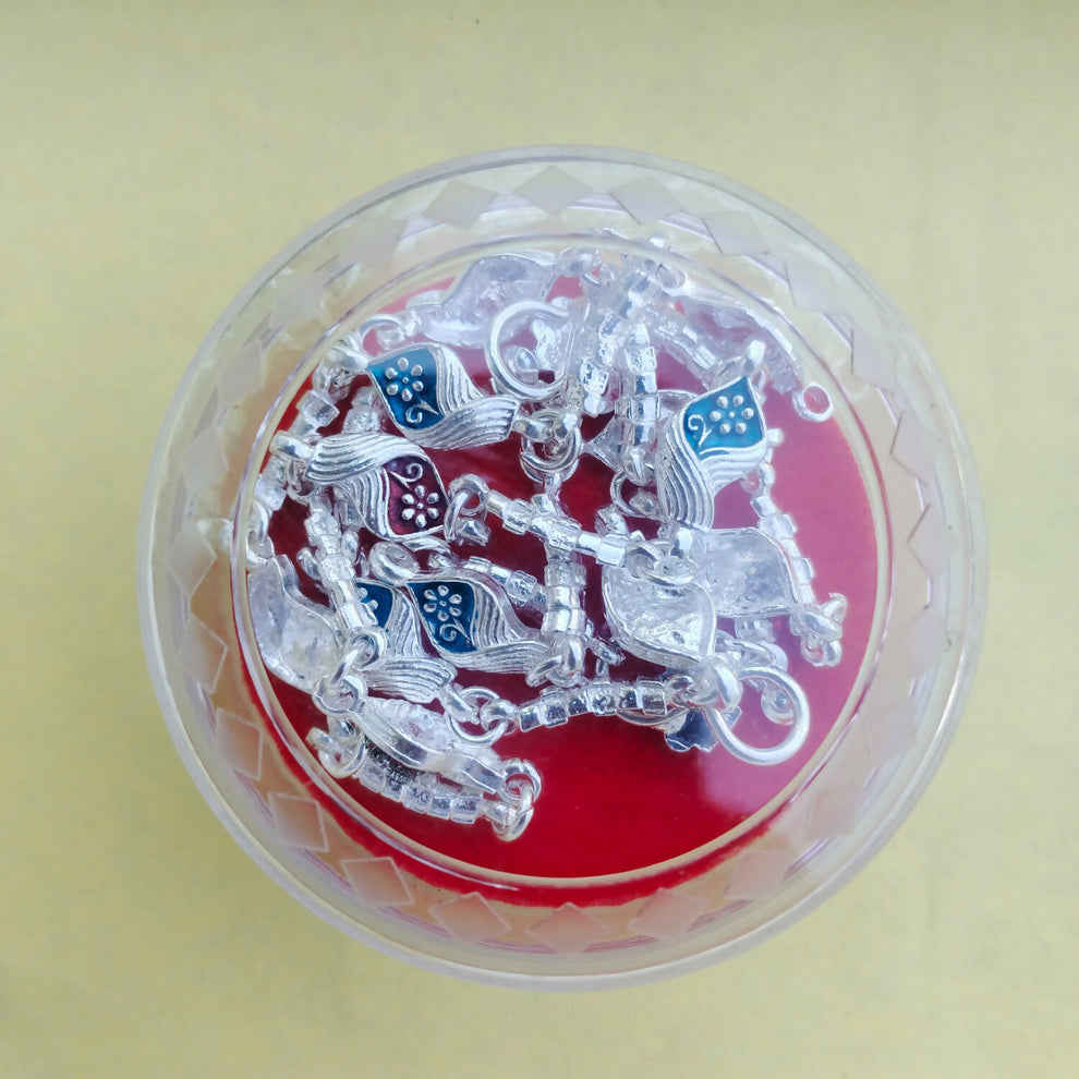 Intricate leaf/floral patterns featuring vibrant red, navy blue, and b